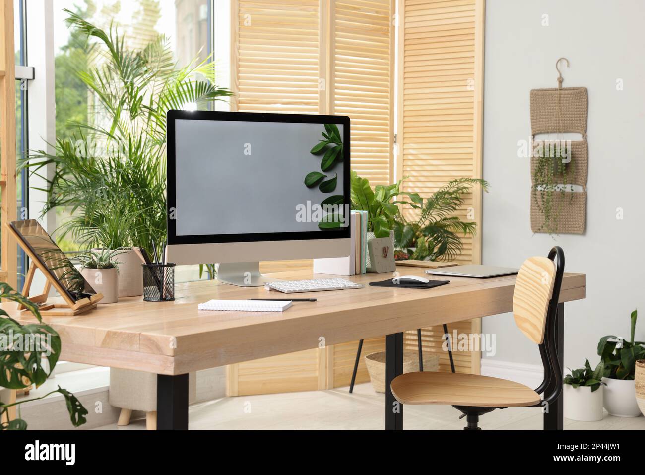 Comfortable workplace with computer in light room. Interior design ...
