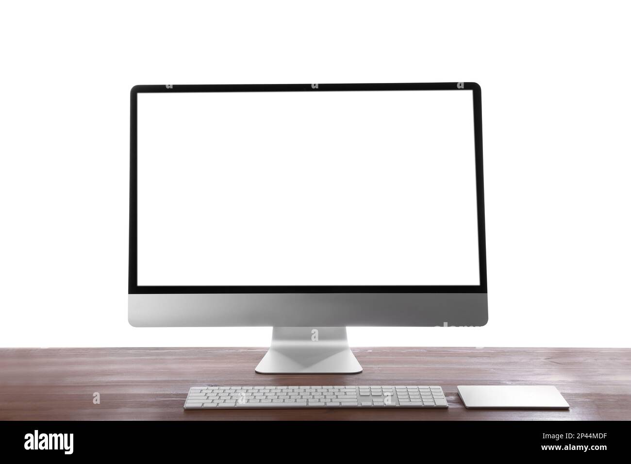 Modern computer with blank monitor screen and peripherals on wooden ...