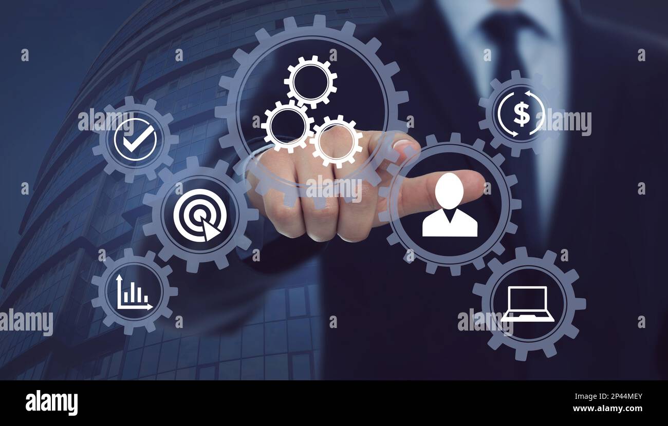 Business process. Man touching virtual screen with different icons ...
