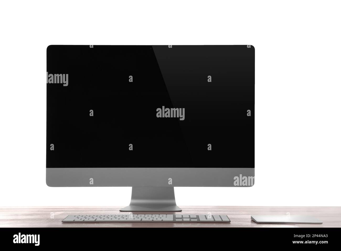 Modern computer with blank monitor screen and peripherals on wooden ...