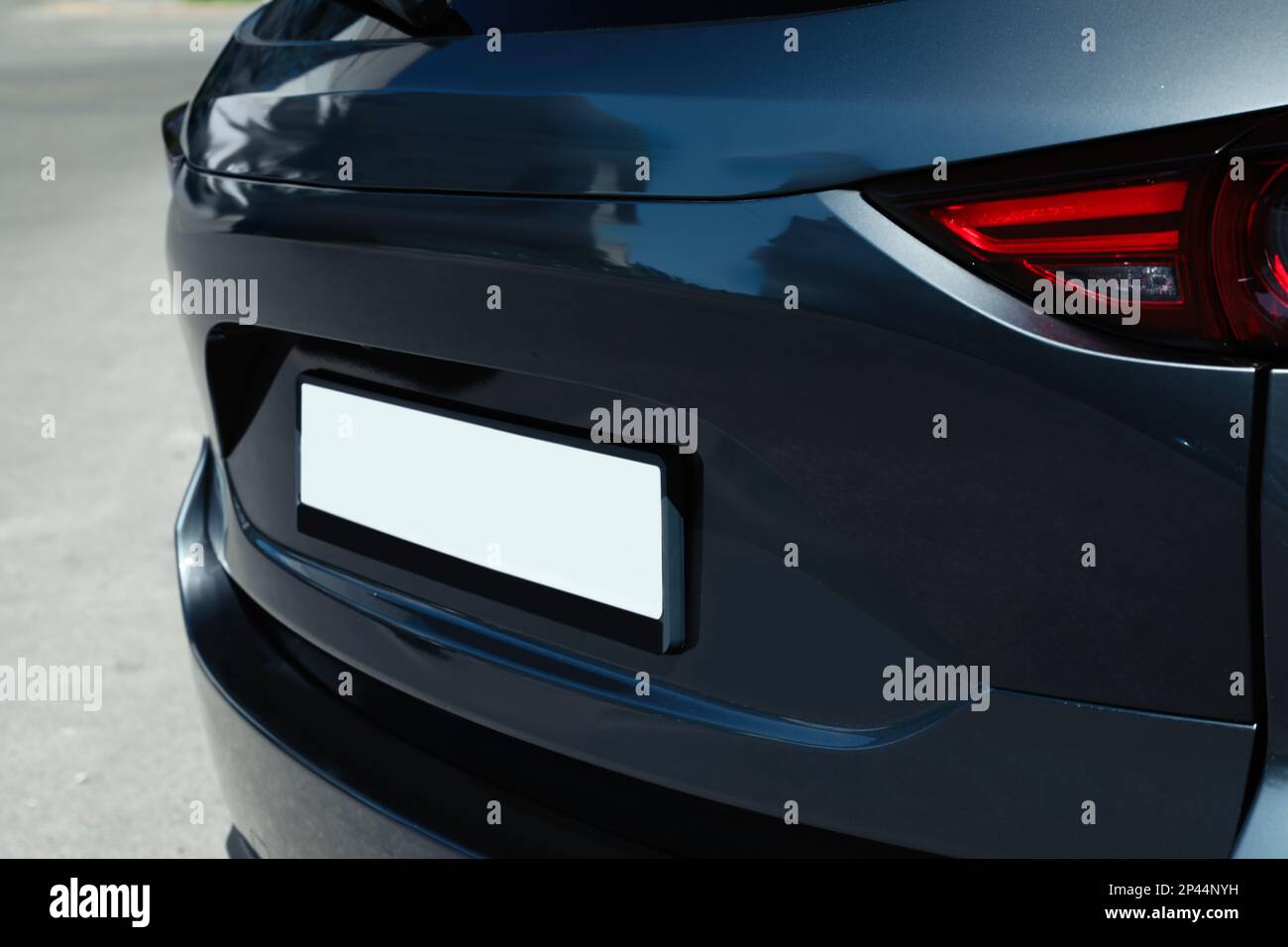 Car with vehicle registration plate outdoors, closeup Stock Photo - Alamy