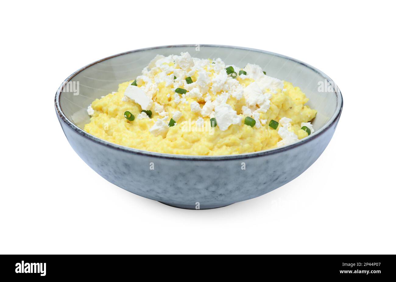 Tasty banosh with brynza and cut green onions in bowl isolated on white ...