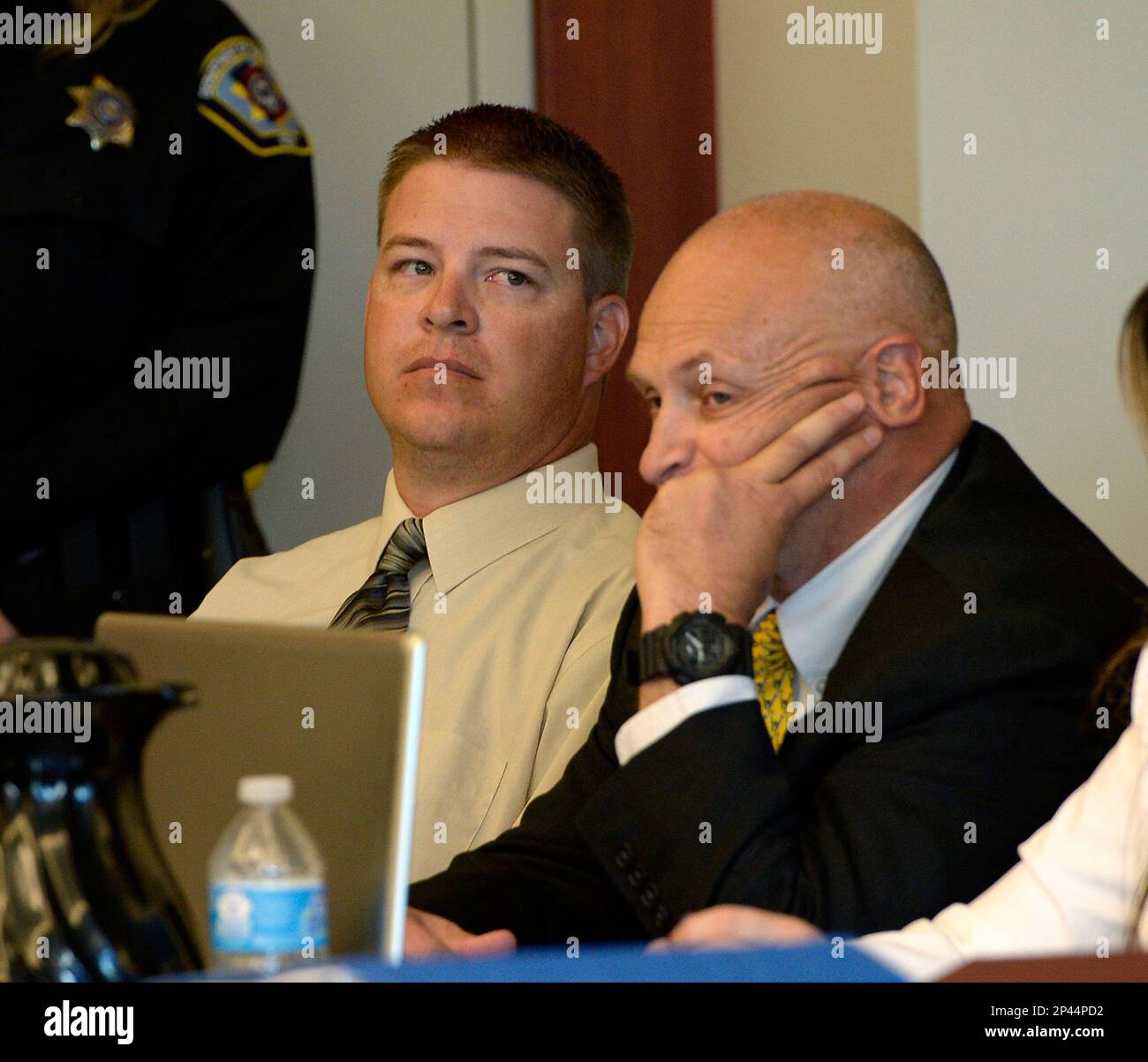 Former West Valley City police officer Shaun Cowley, left, looks on as ...
