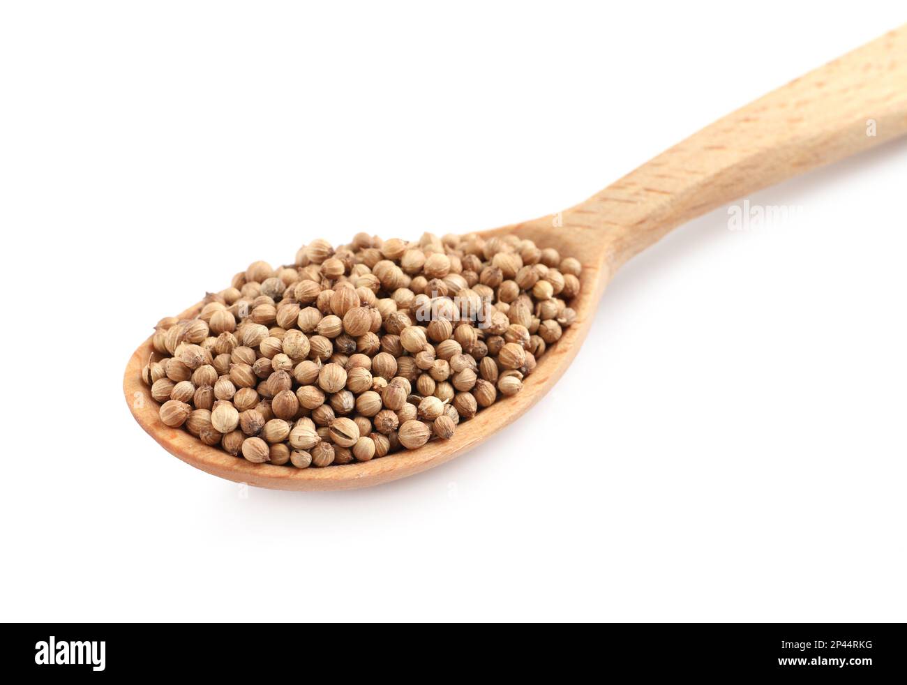 Dried coriander seeds with wooden spoon isolated on white Stock Photo - Alamy
