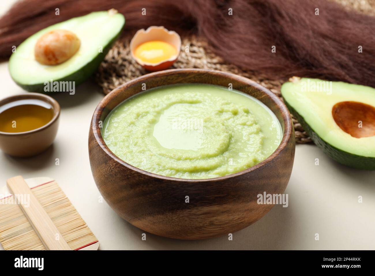 Homemade hair mask, ingredients and comb on beige background Stock ...