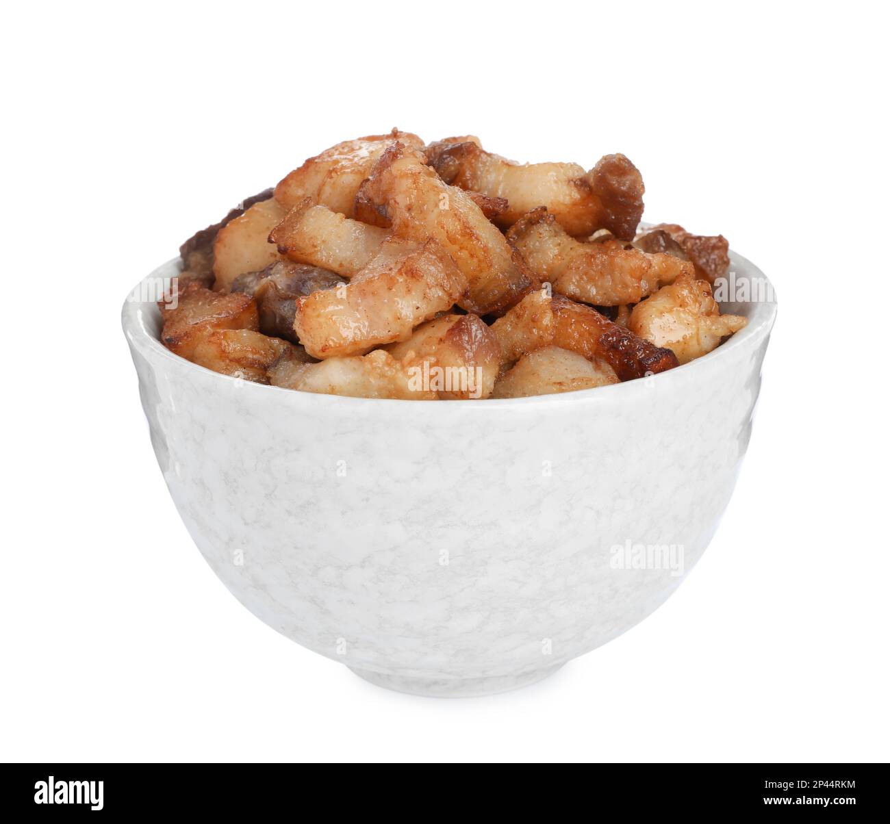 Tasty fried cracklings in bowl on white background. Cooked pork lard ...