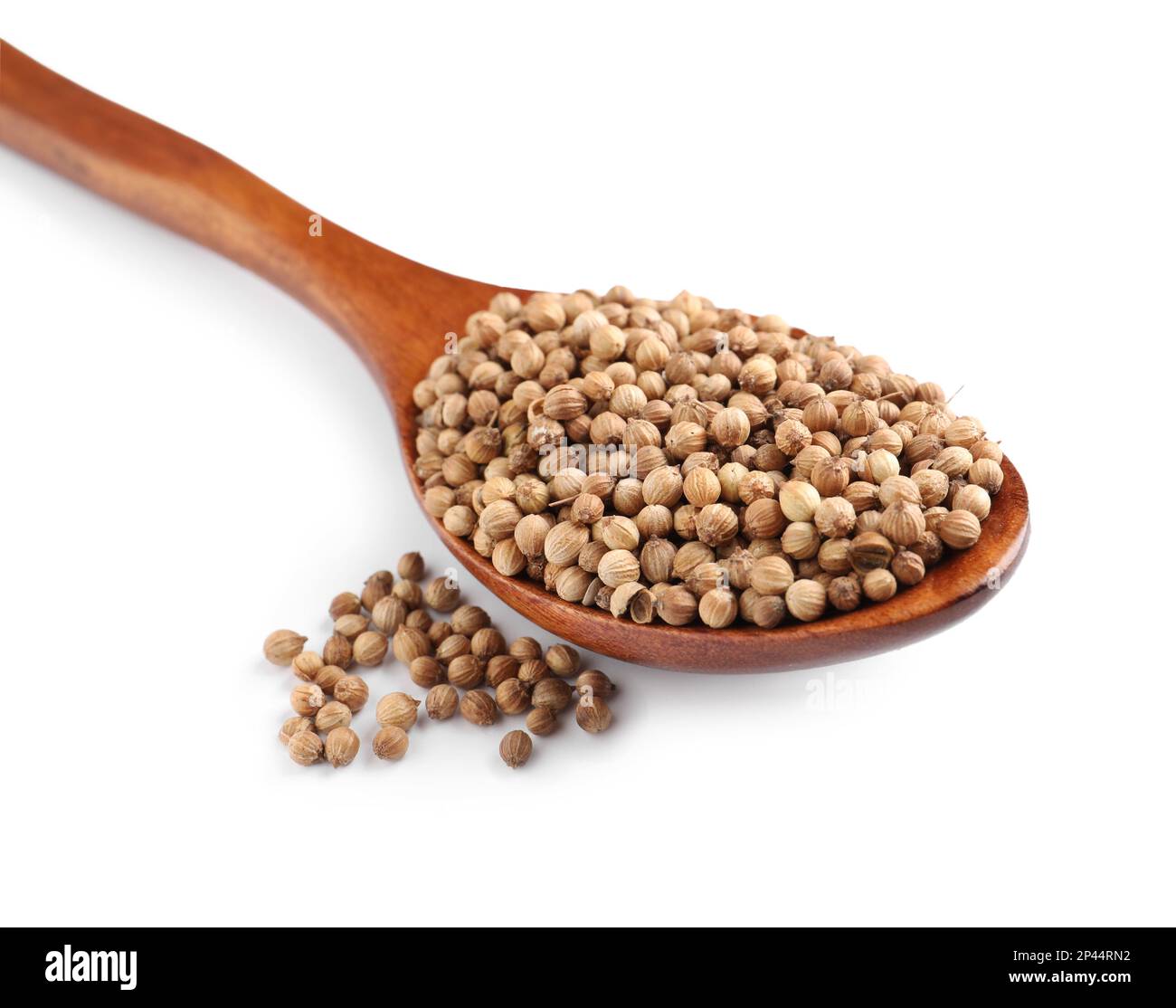 Dried coriander seeds with wooden spoon on white background Stock Photo - Alamy
