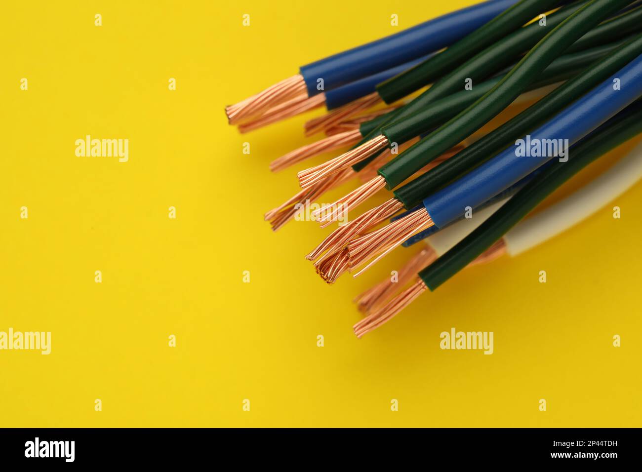 Electrical wires on yellow background, closeup. Space for text Stock ...