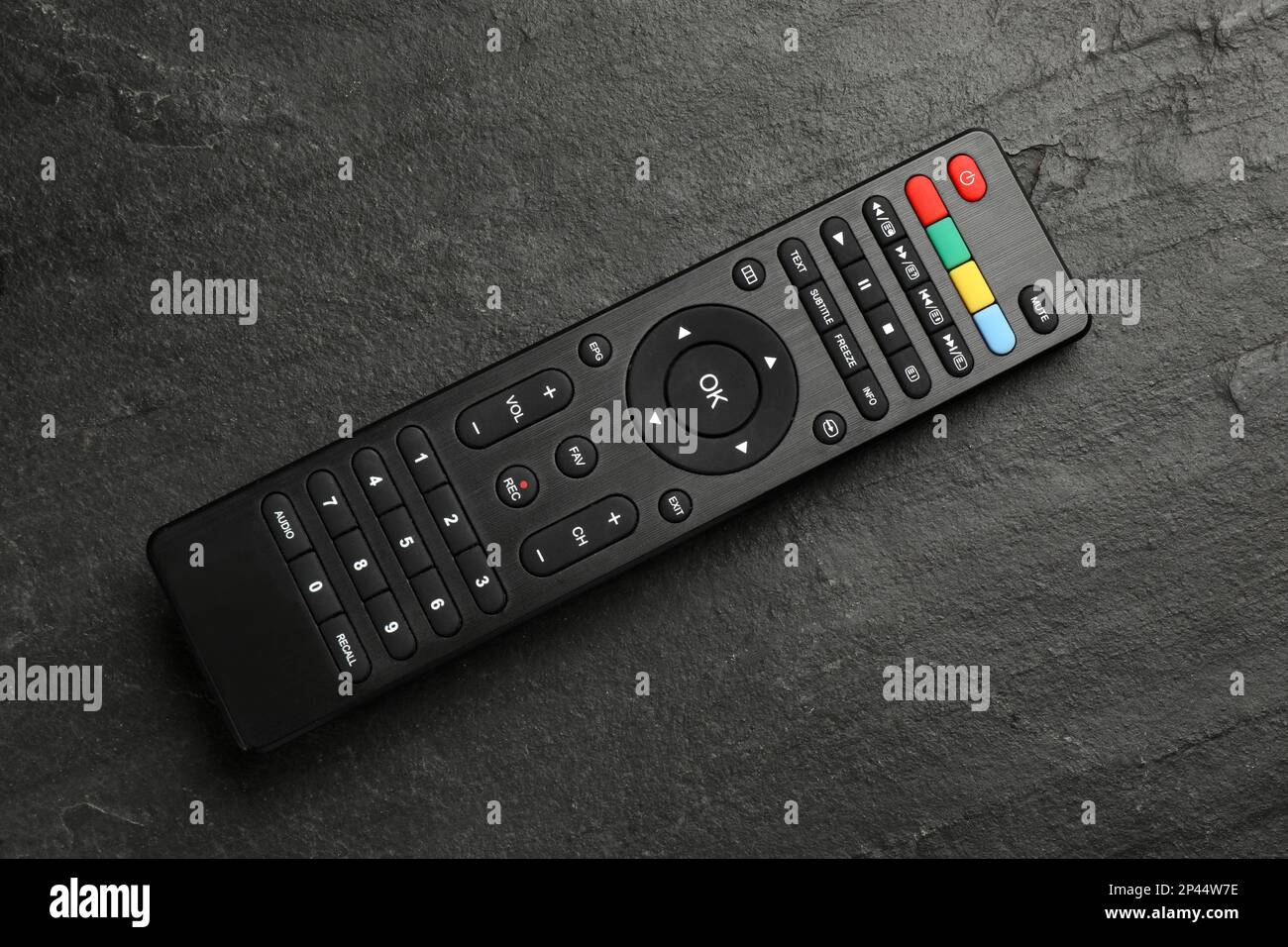 Modern tv remote control on black table, top view Stock Photo - Alamy
