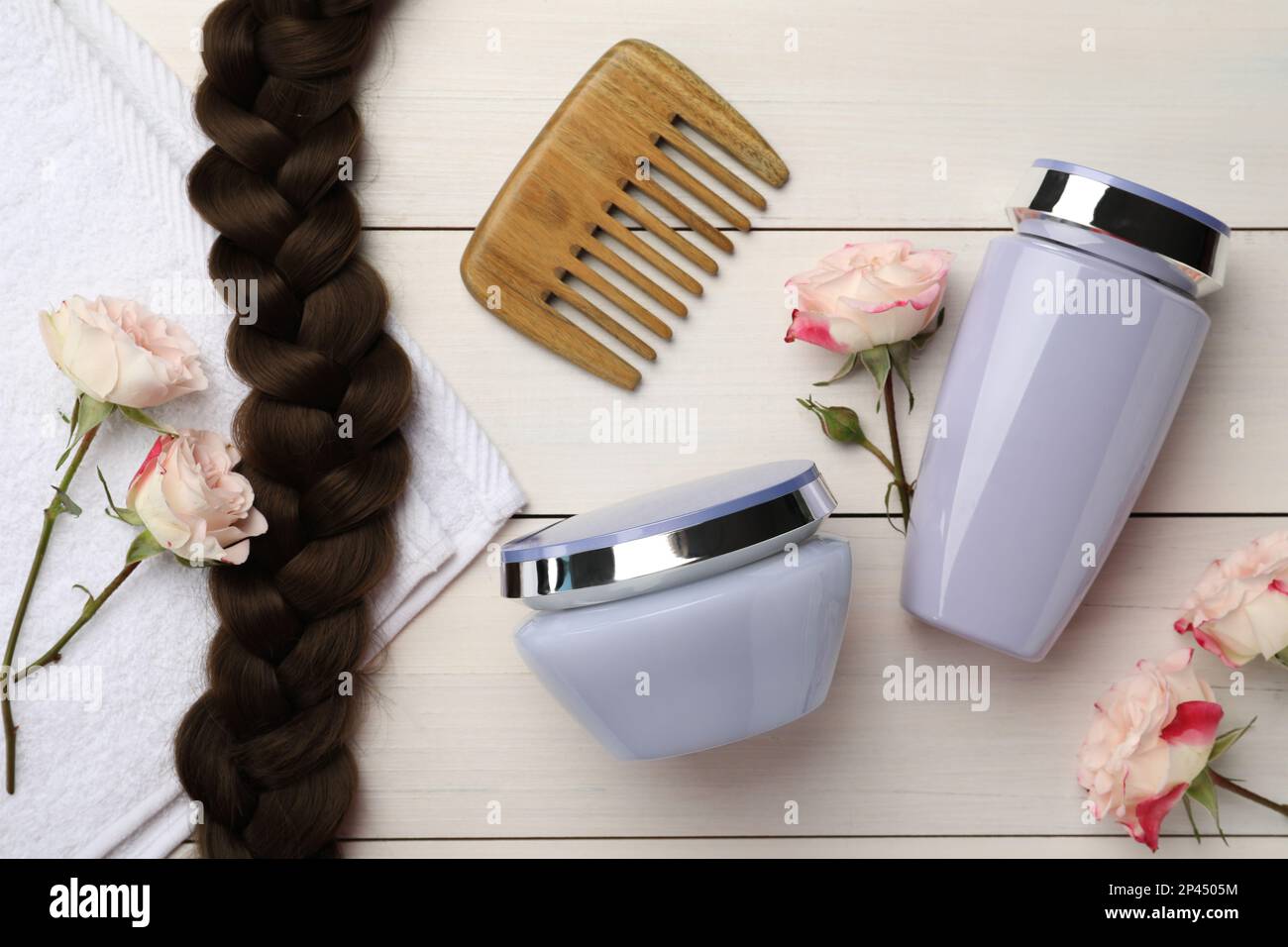 Flat lay composition with natural cosmetic products and hair braid on ...