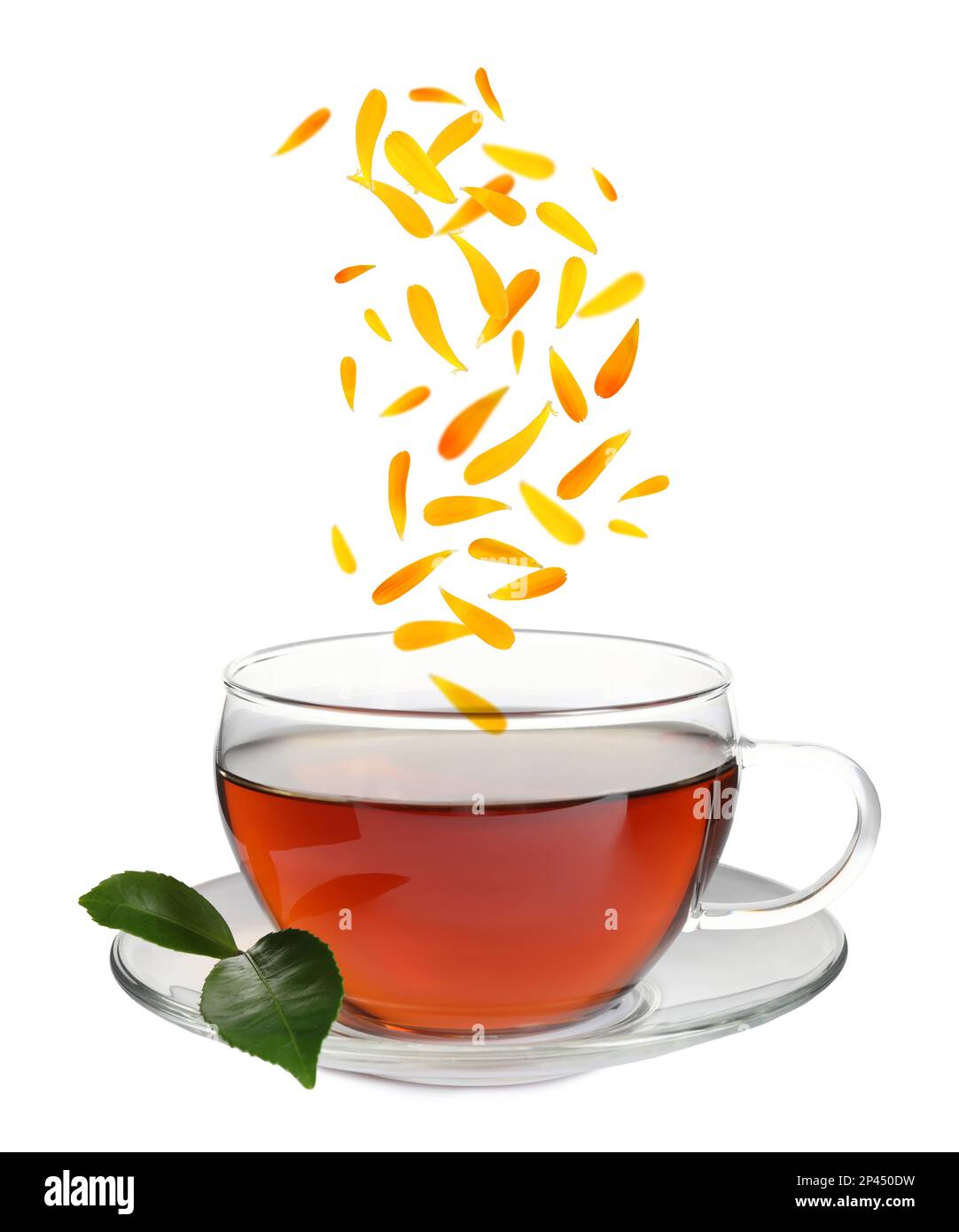 Beautiful calendula petals falling into cup of freshly brewed tea on ...