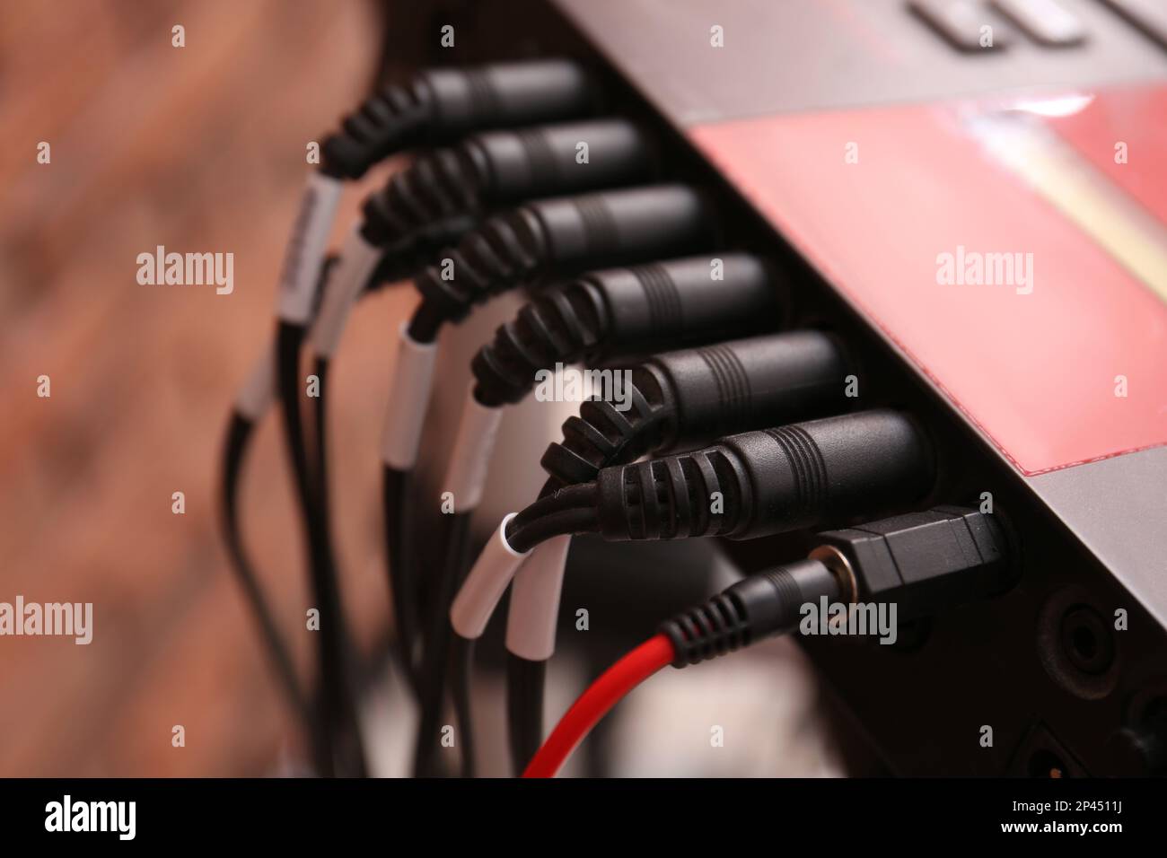 Modern electronic drum module with cables, closeup. Musical instrument ...