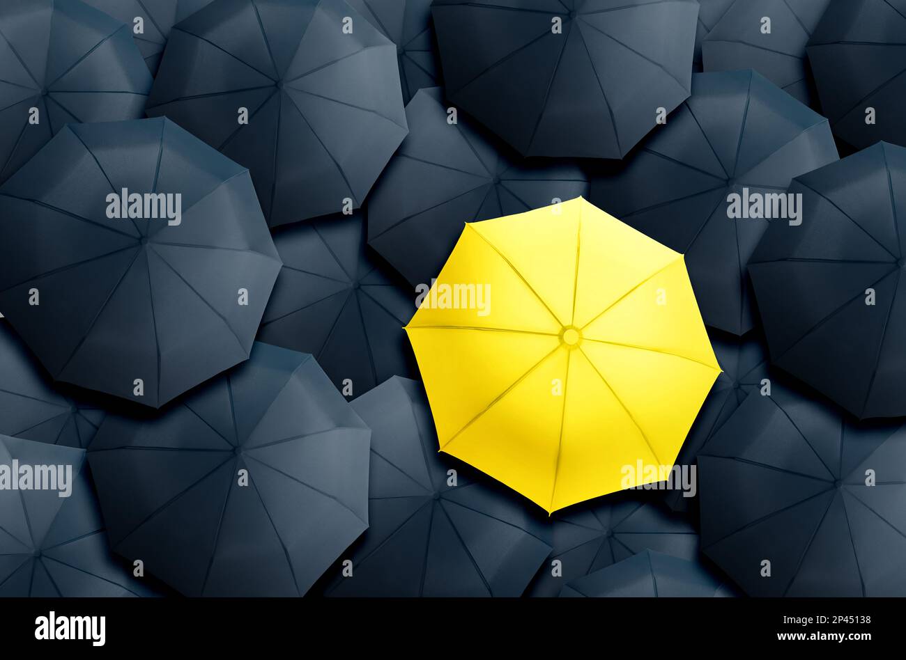 Yellow umbrella standing out of other ones, top view Stock Photo - Alamy