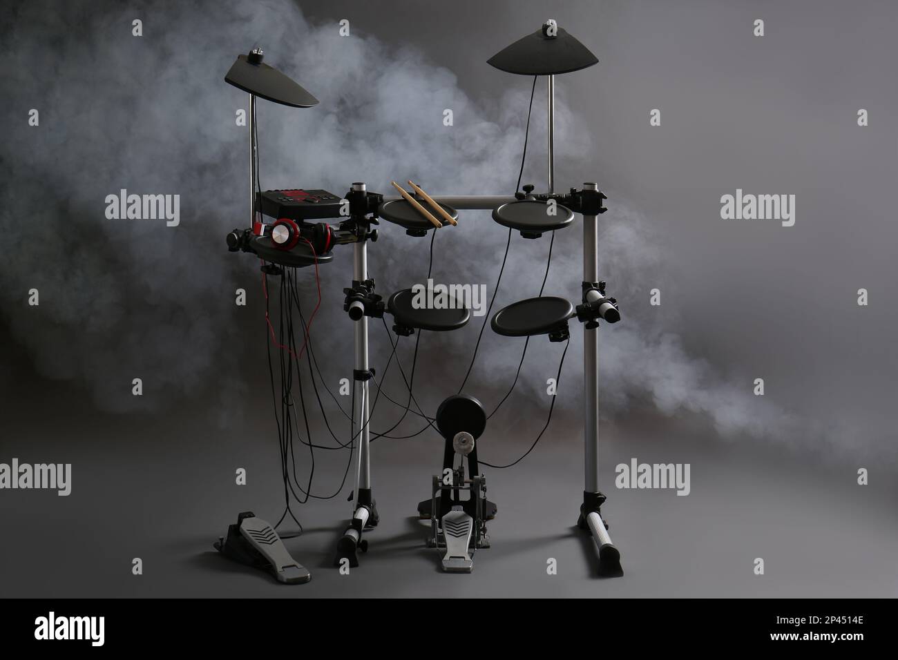 Modern electronic drum kit and smoke on grey background. Musical ...