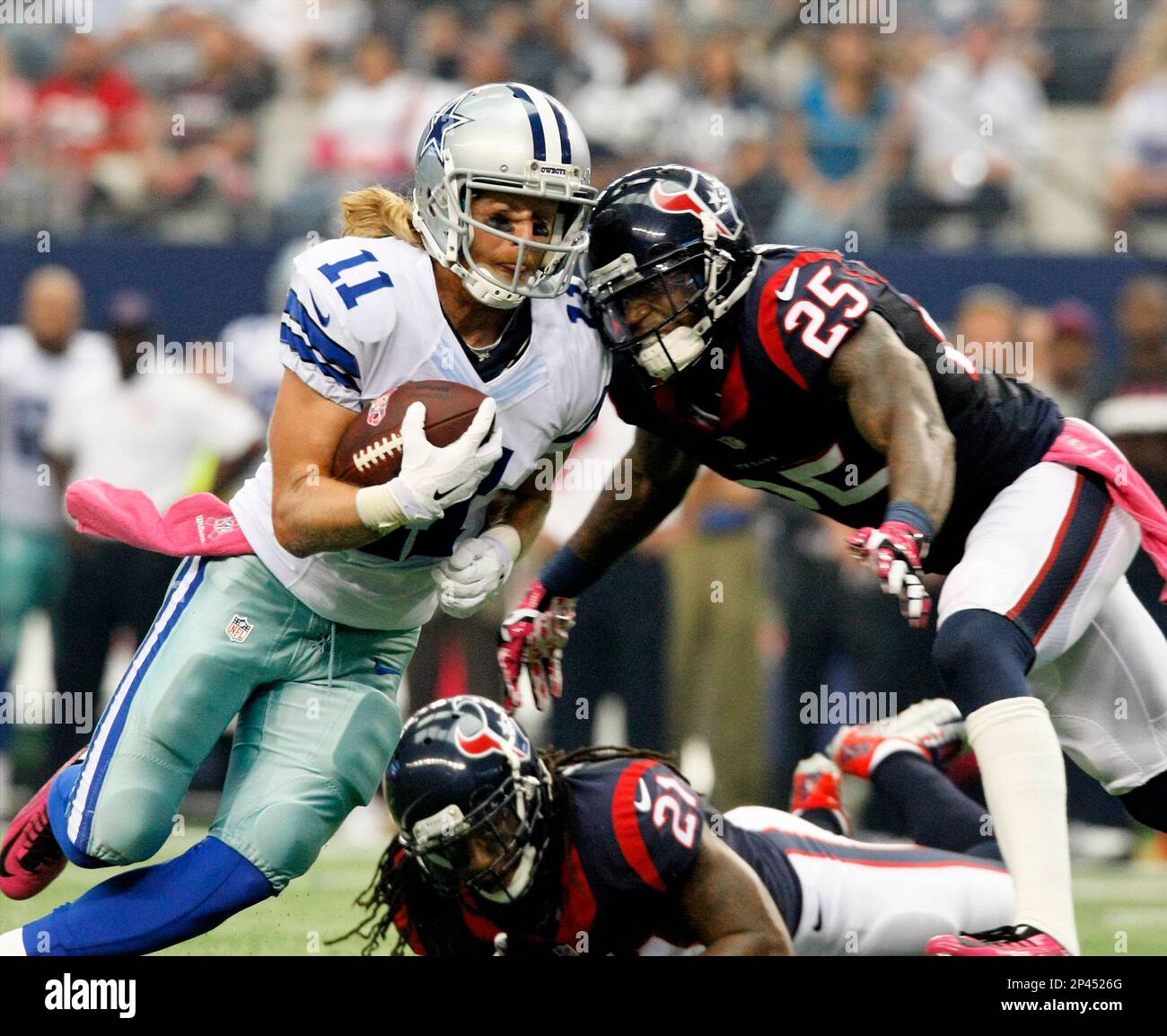 Dallas Cowboys wide receiver Cole Beasley (11) is tackled by Houston ...