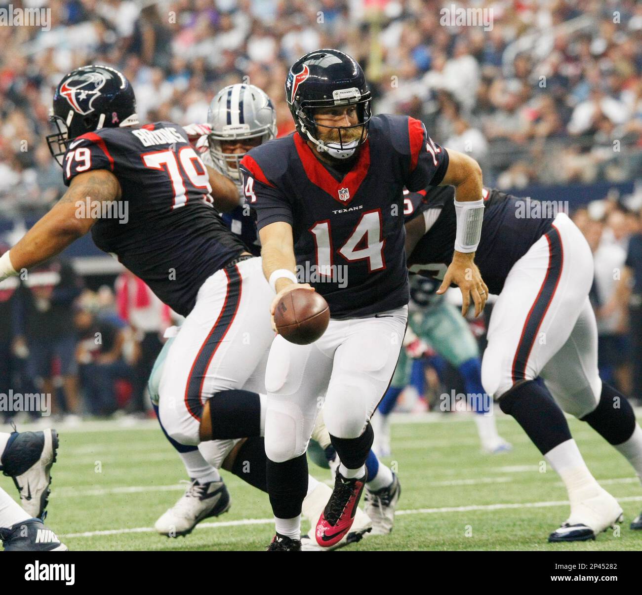 Houston Texans quarterback Ryan Fitzpatrick (14) hands off the ball ...