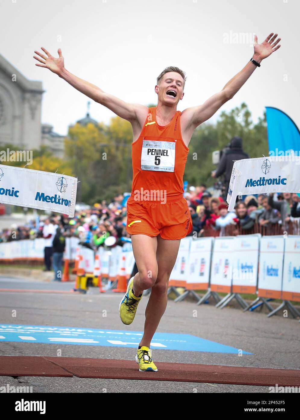 Men's marathon winner Tyler Pennel crossed the finish line of the 2014 ...