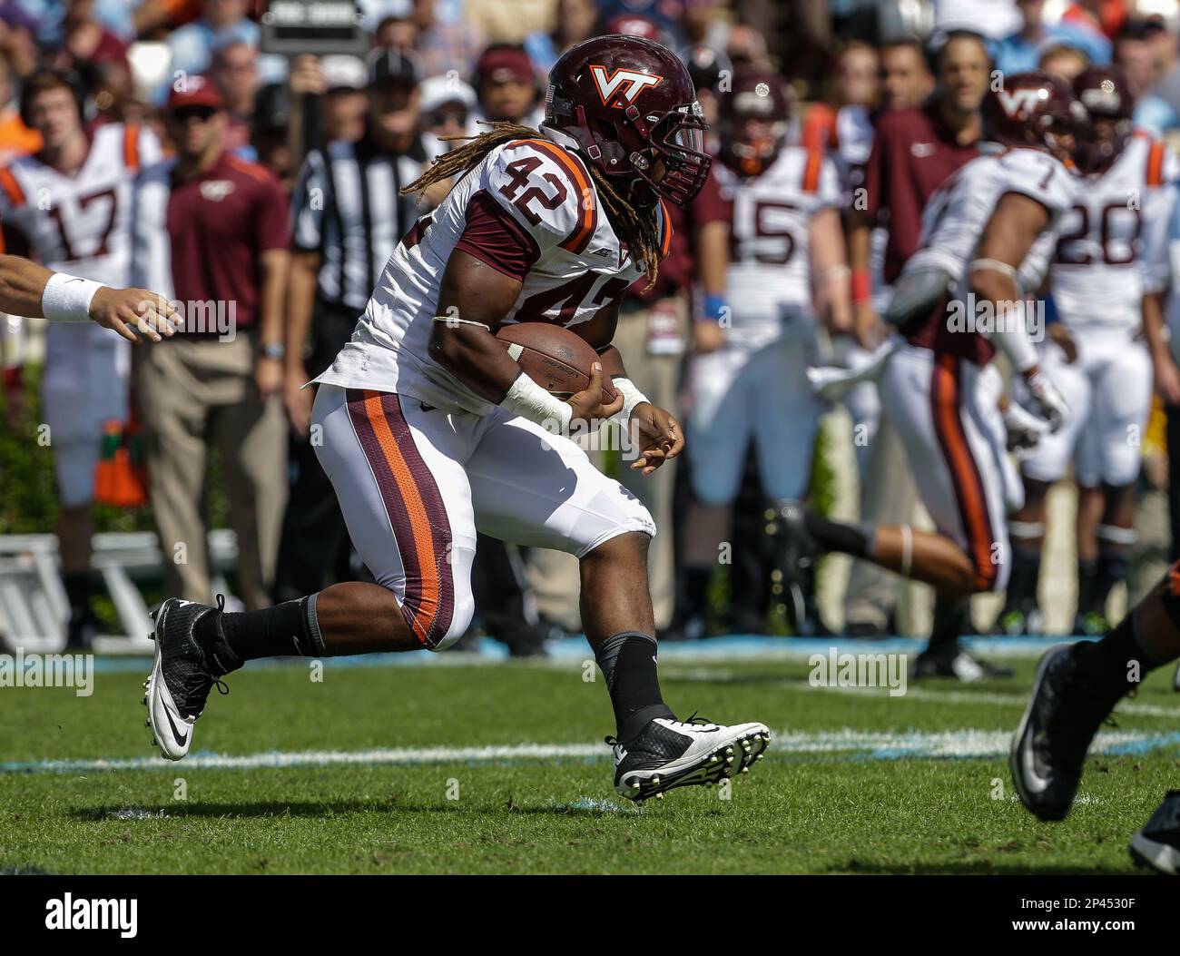 Virginia Tech Hokies running back Marshawn Williams (42) finds a hole ...