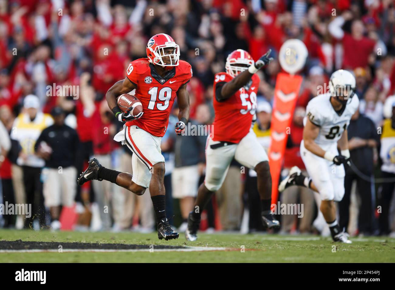 Georgia Bulldogs cornerback Devin Bowman (19) returns an interception ...