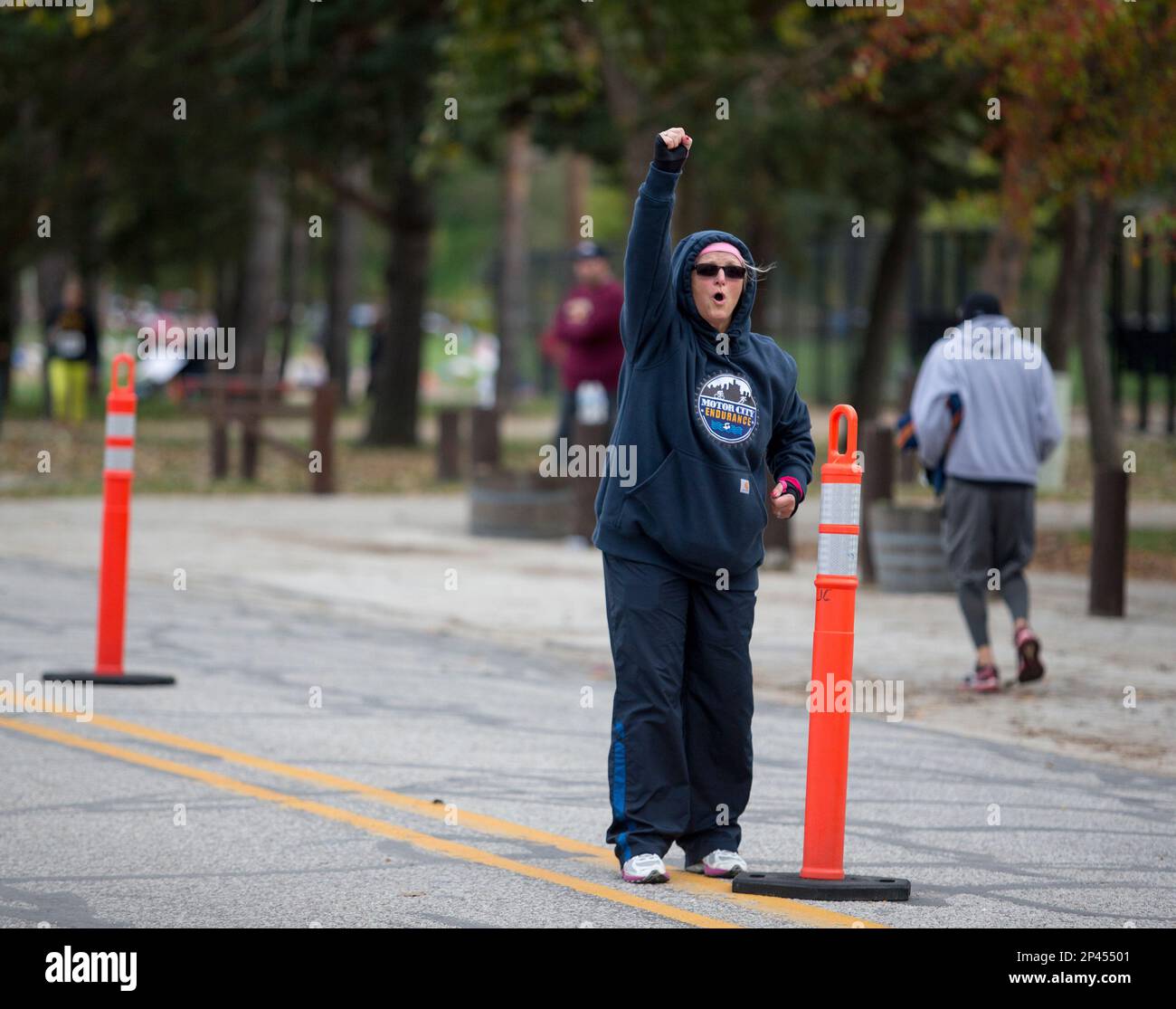 Laura Hubel-Shoemaker, cheers on other runners during the 2014 ...
