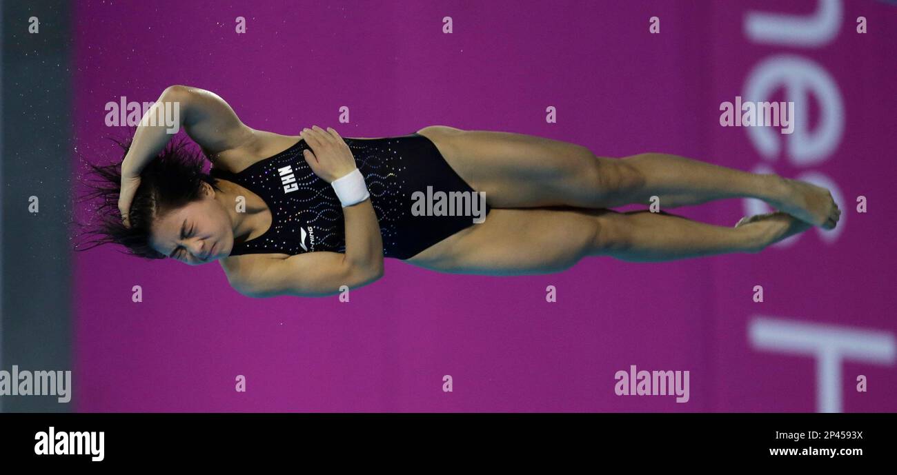 Silver medallist China’s Huang Xiaohui competes in the women’s 10m ...