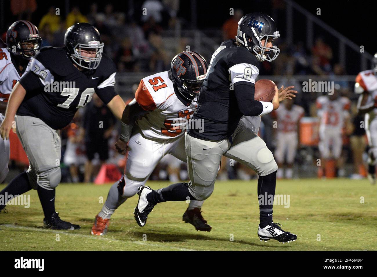 Lake Nona quarterback Tucker Israel (8) scrambles for yardage past ...