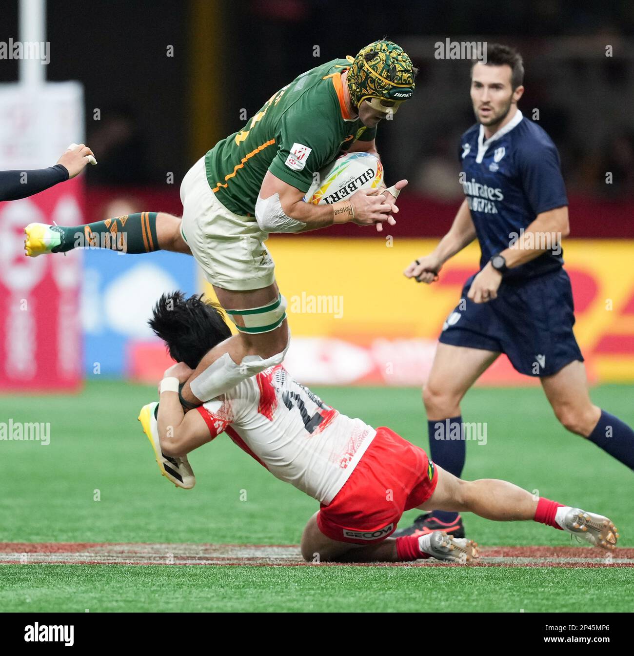 South Africa's Impi Visser, top, is hit by Japan's Kippei Ishida during ...