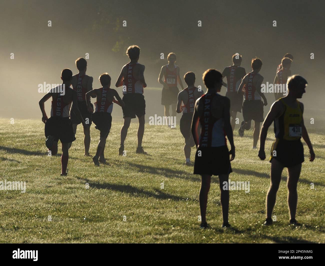 High school runners warm up before the start of the Berrien County ...