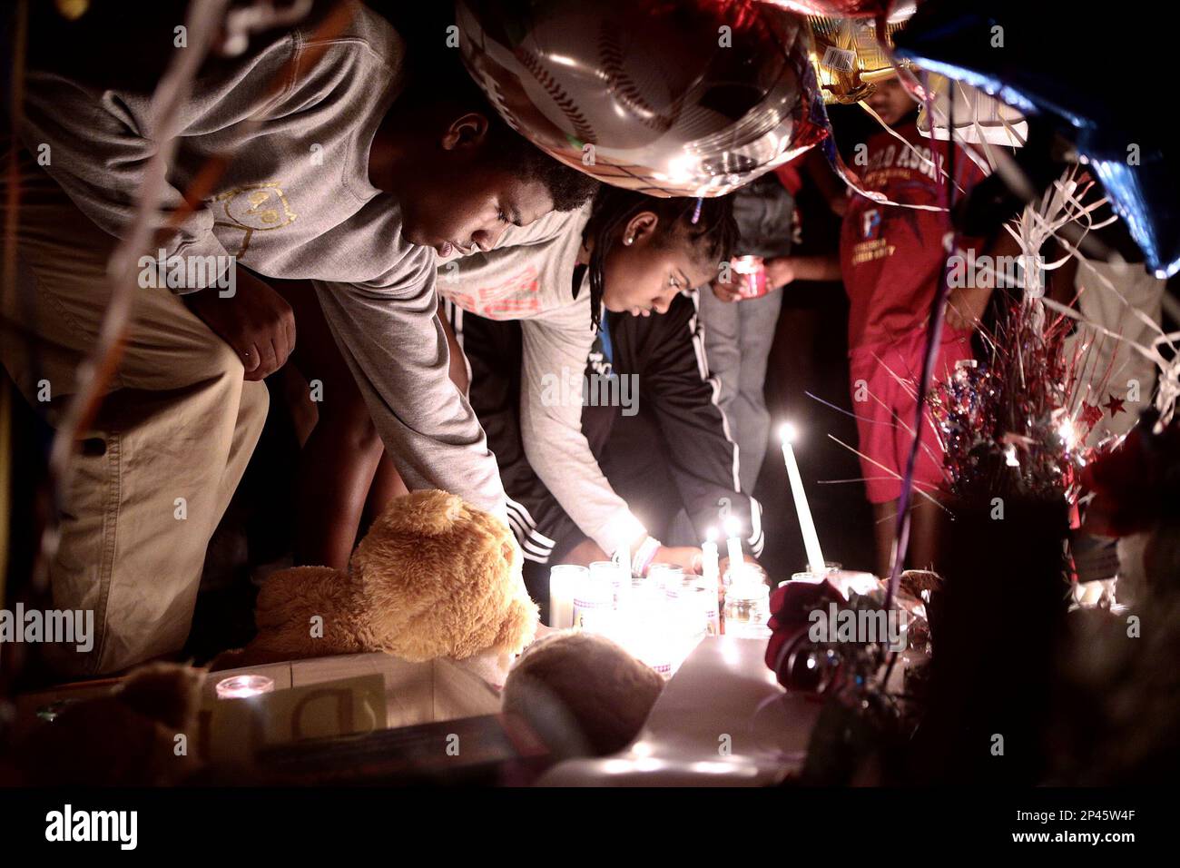 Curtis Anderson Jr. (left), 16, and Shyanna 'Lynn Wallis, 14, place ...