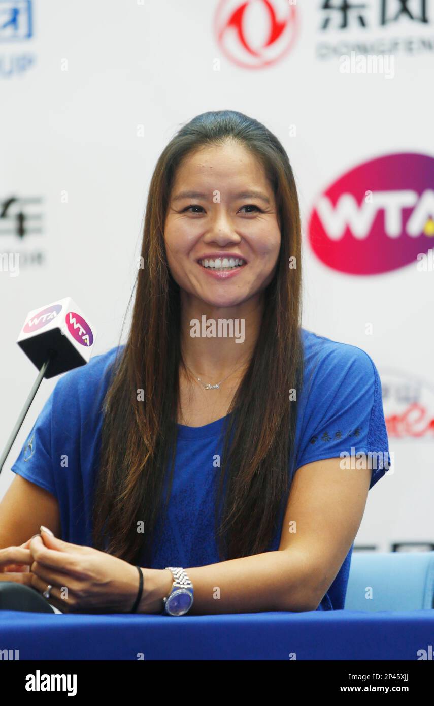 Chinese tennis star Li Na laughs at a press conference during the 2014 ...