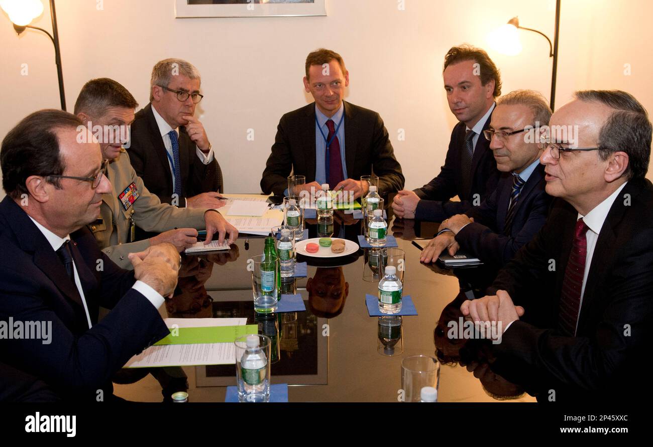 French President Francois Hollande, left, meets with Syrian National ...