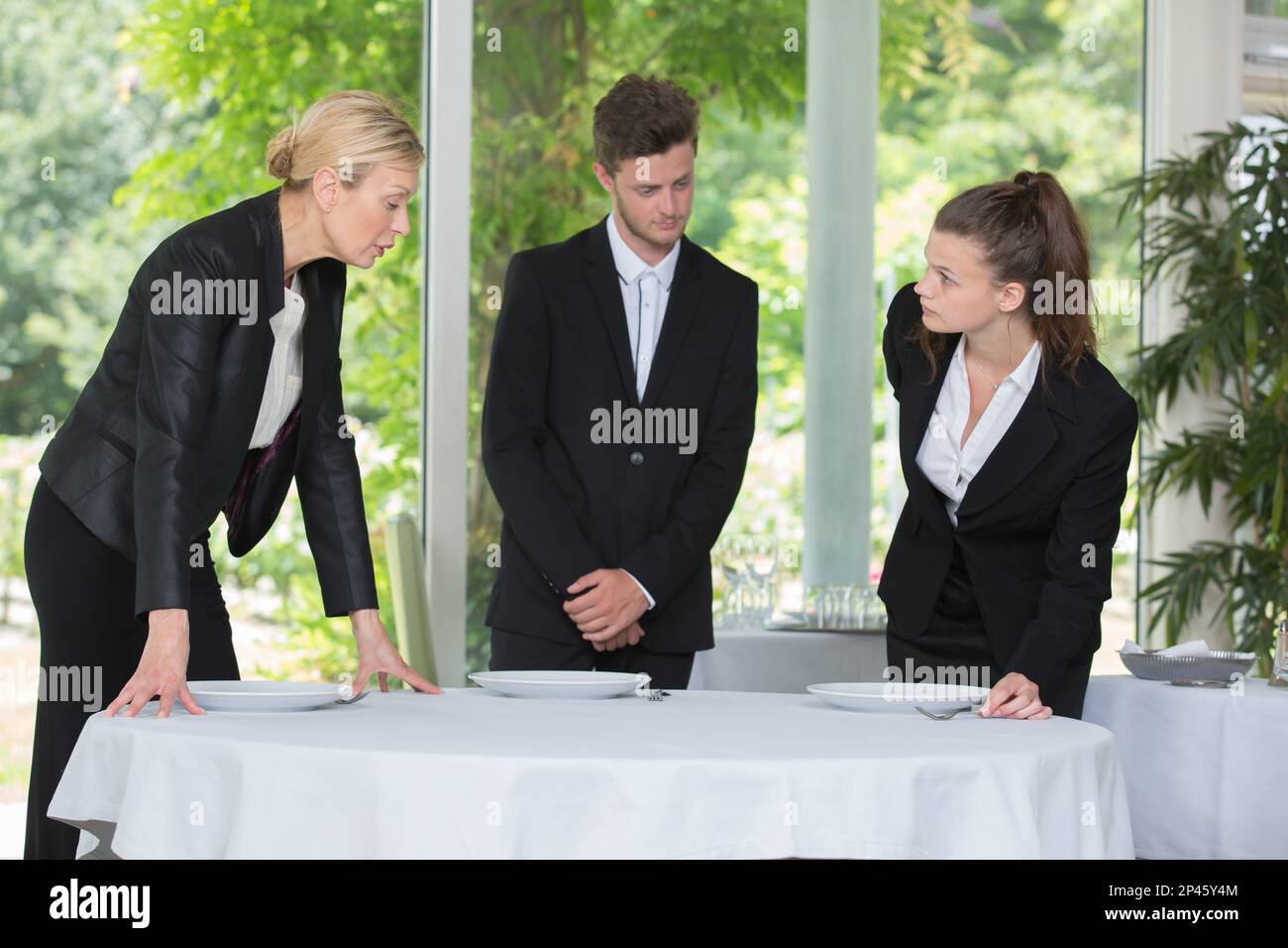 full length portrait of confident restaurant staff Stock Photo - Alamy