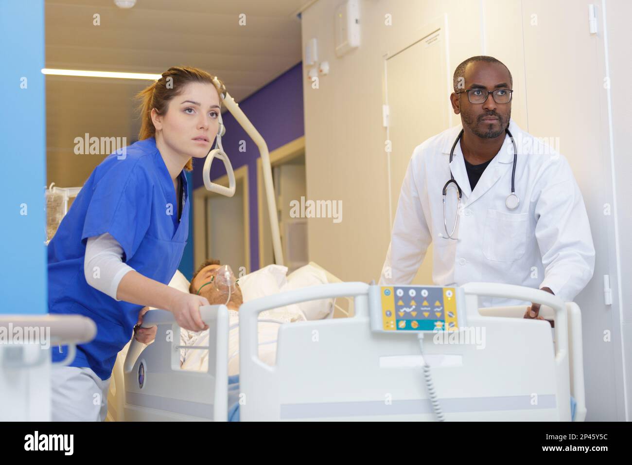nurse and doctor in a hurry taking patient to operation-theatre Stock ...