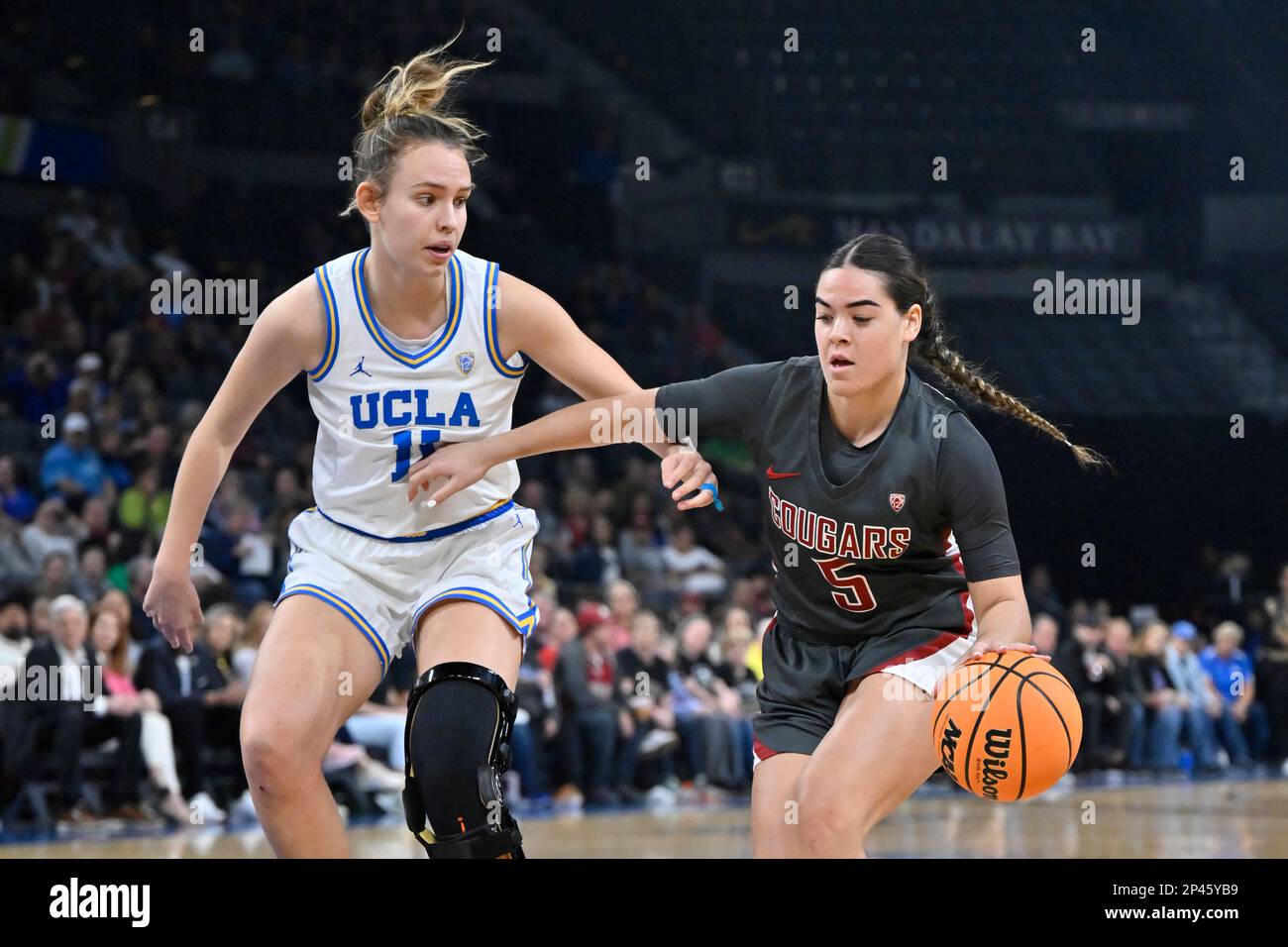 Washington State guard Charlisse Leger-Walker handles the ball against ...