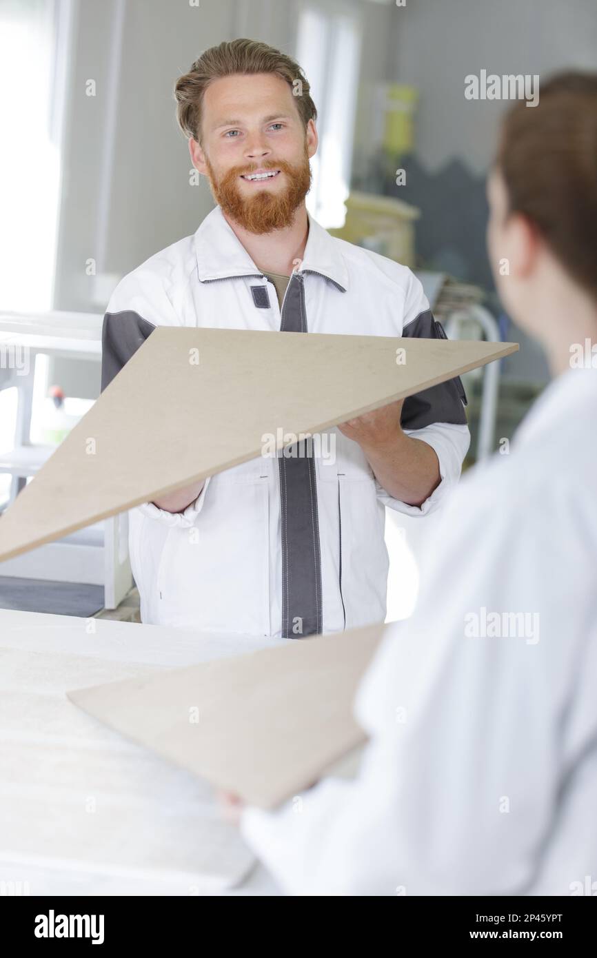 man checks the evenness of the paint application Stock Photo - Alamy
