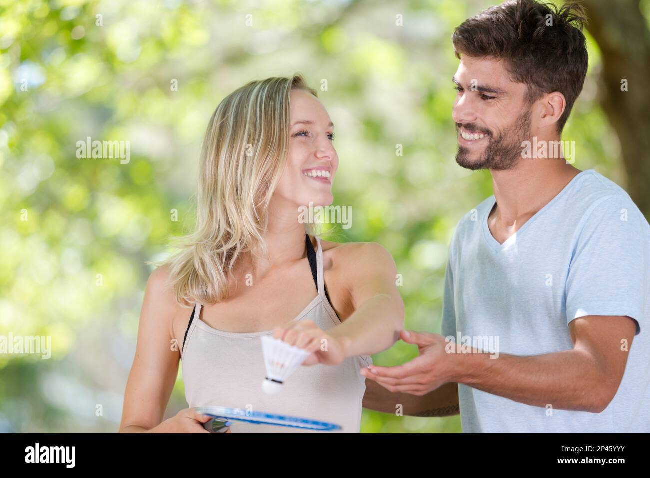 happy couple playing badminton outdoors Stock Photo - Alamy