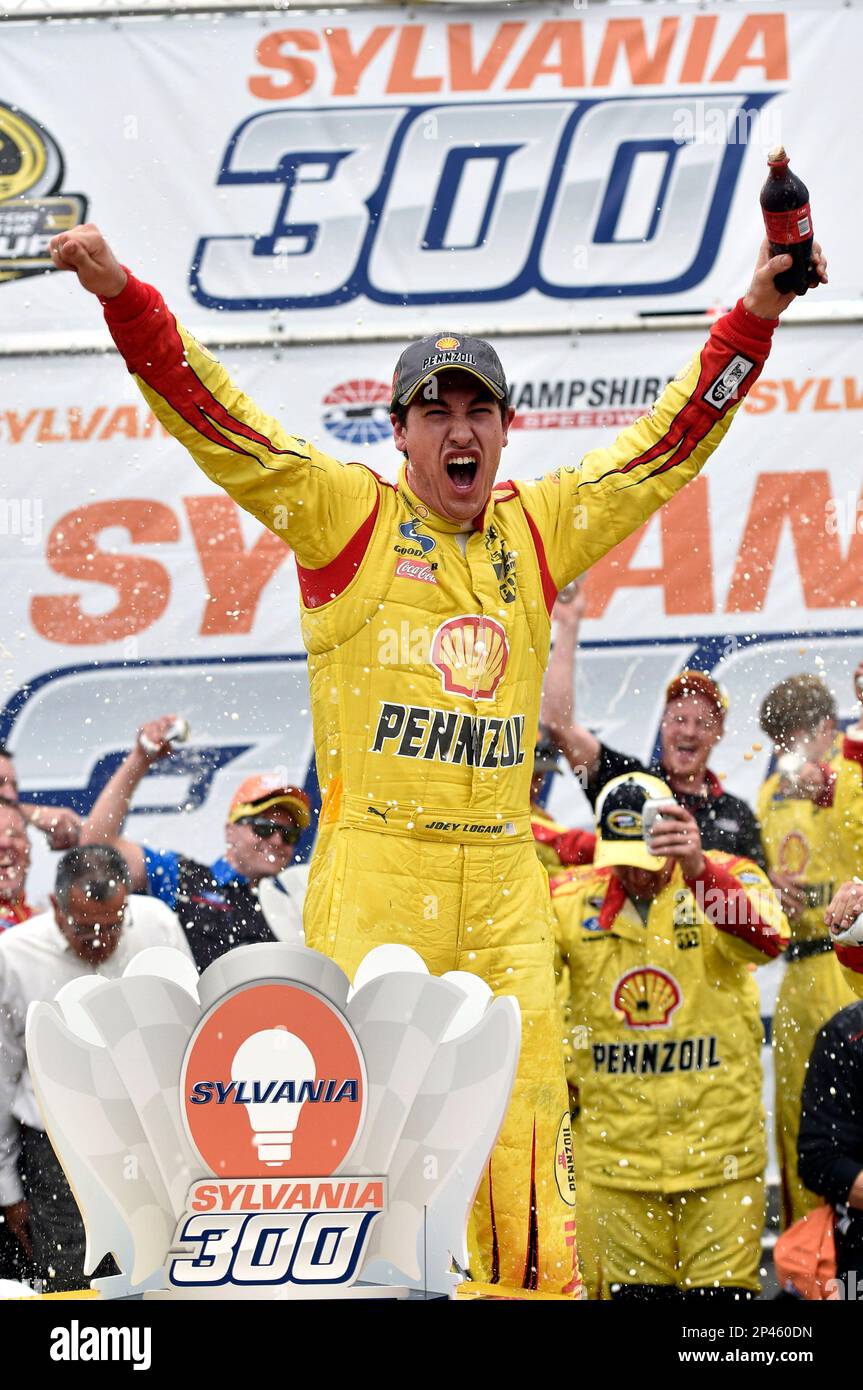 Joey Logano (22) celebrates his win in Victory Lane during the NASCAR ...