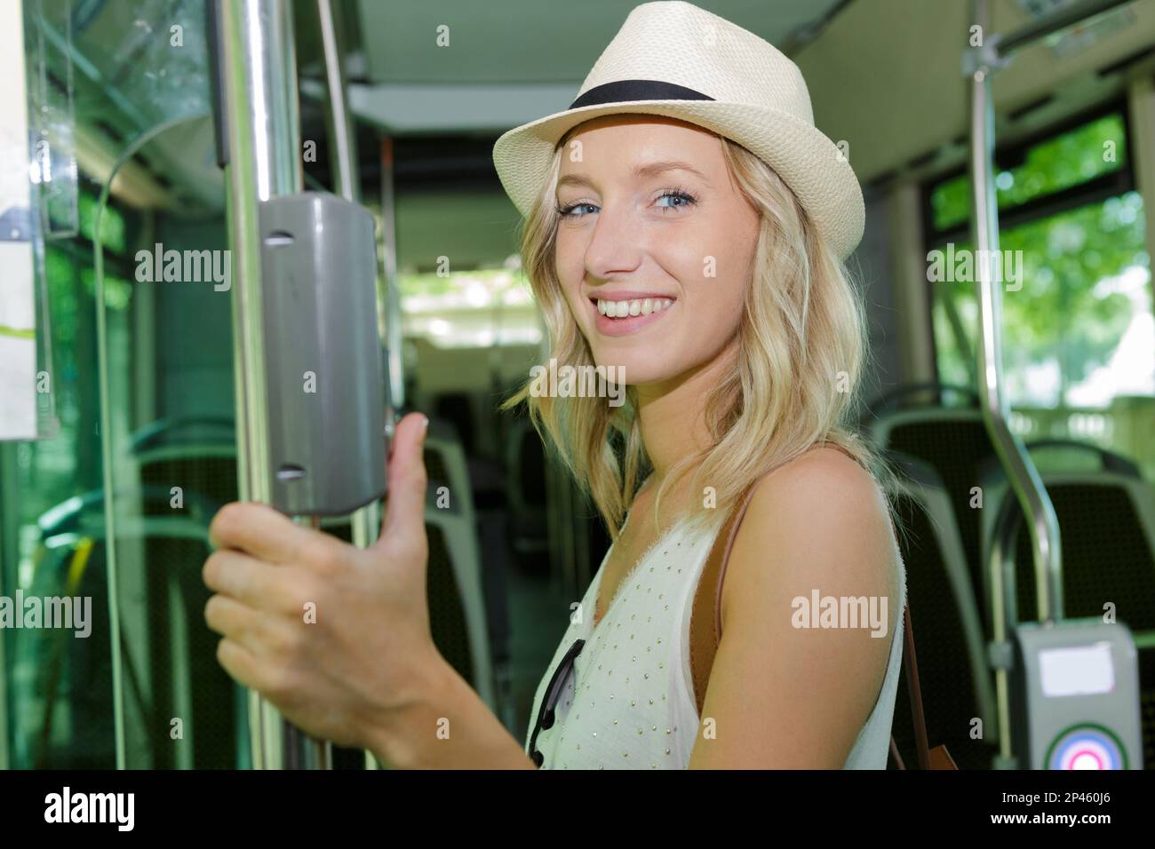 girls is standing inside a bus calling for stop Stock Photo - Alamy