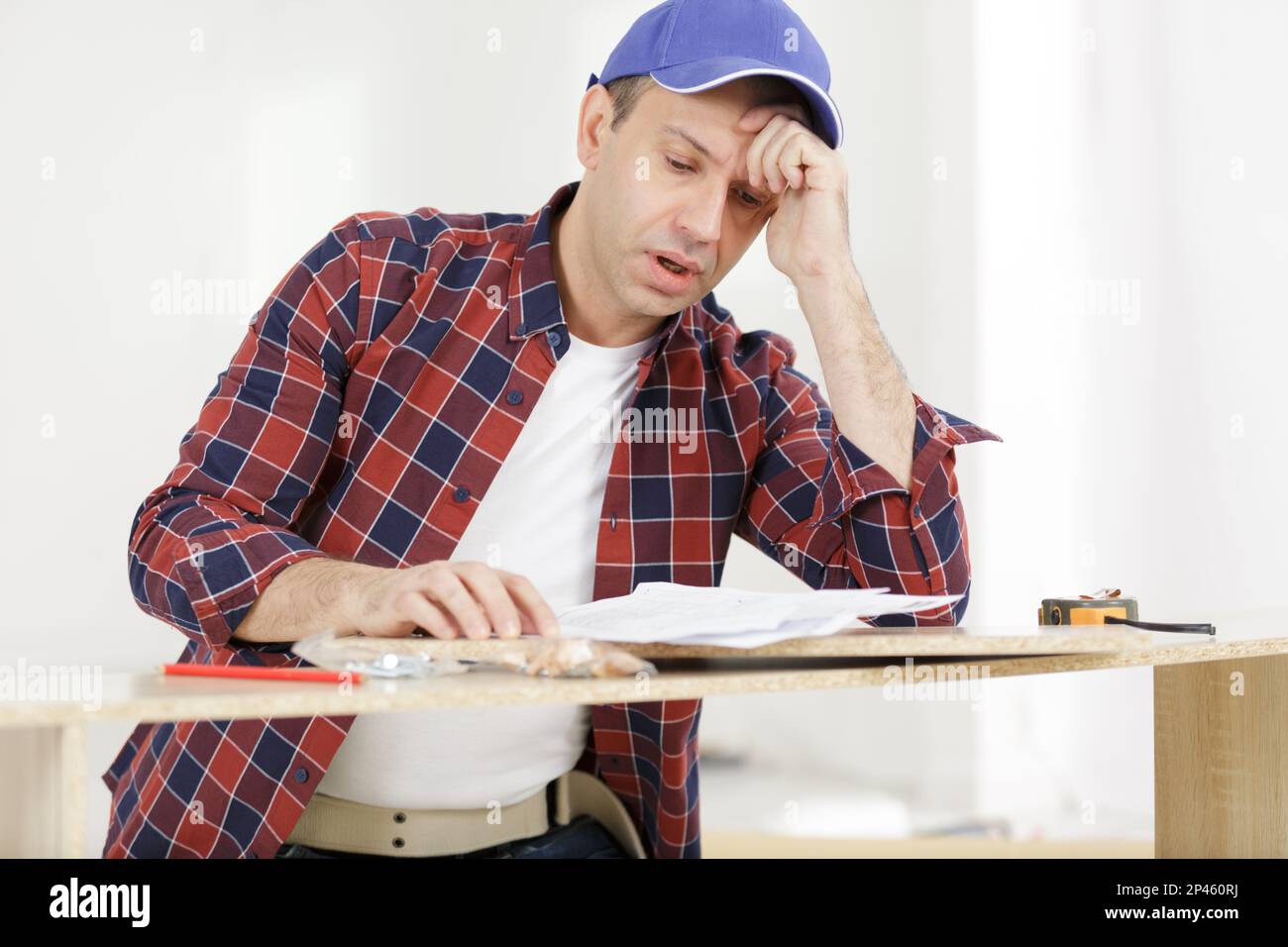Person reading instruction manual hi-res stock photography and images ...