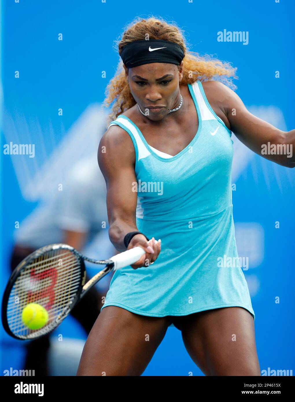Serena Williams of the United States returns a shot to Alize Cornet of ...