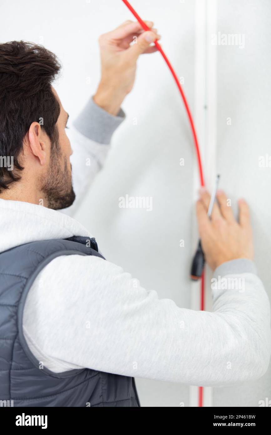 electrician making wiring at new house Stock Photo - Alamy
