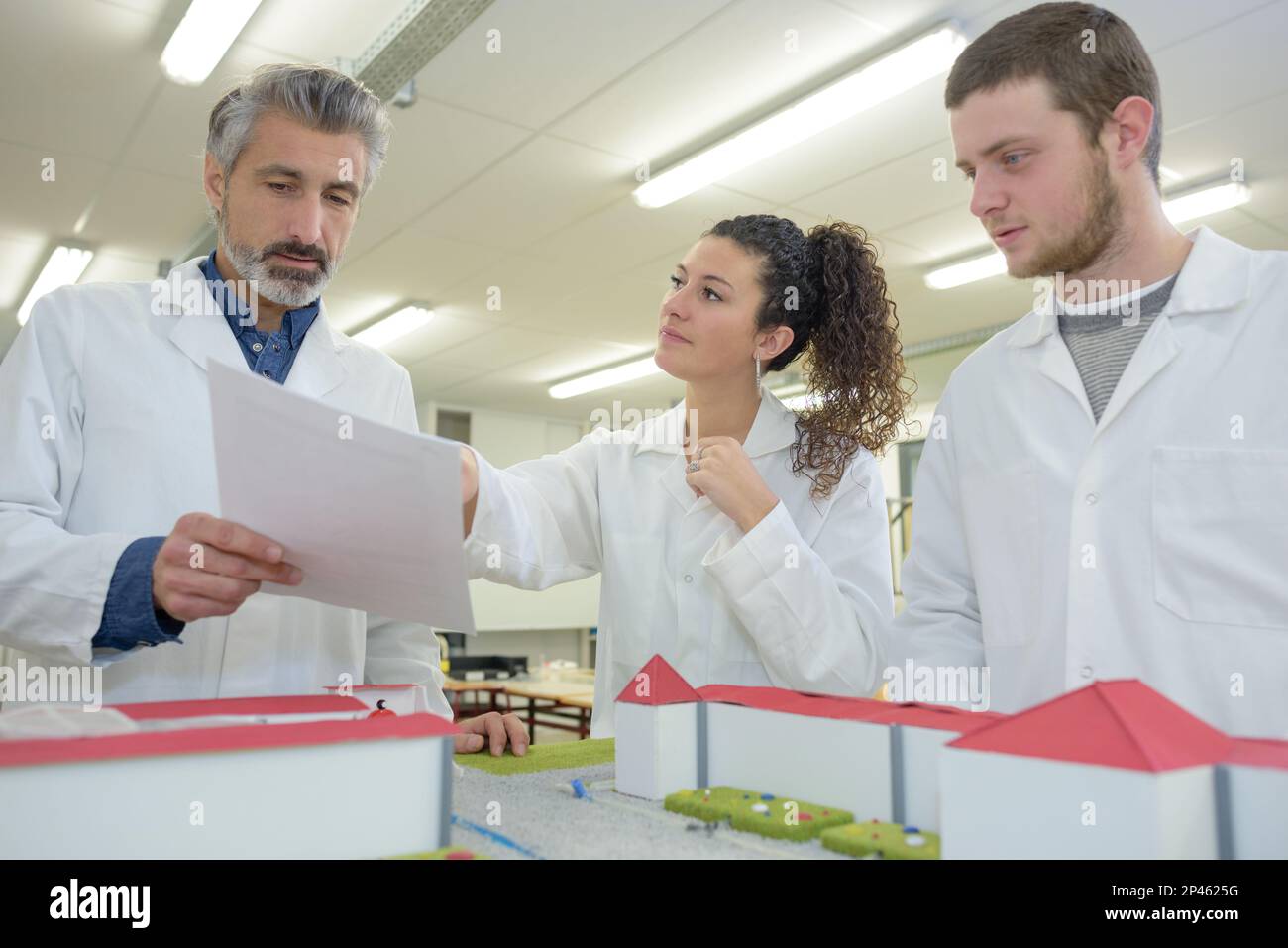artistic positive students working on new exciting project Stock Photo ...