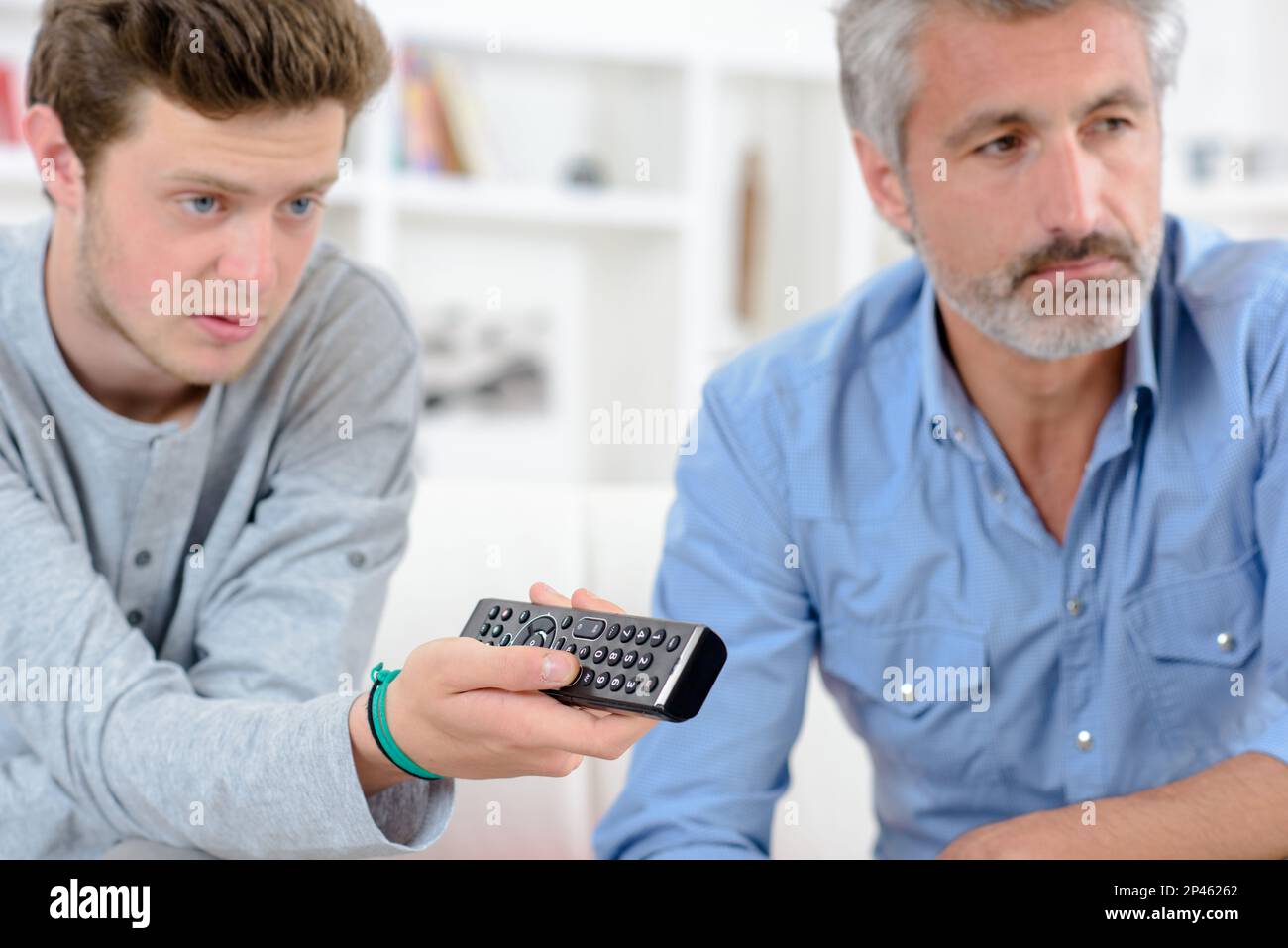 men with a remote control Stock Photo - Alamy