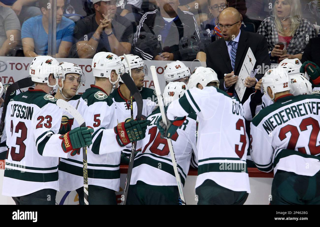 Minnesota Wild head coach Mike Yeo talks to his team during third ...