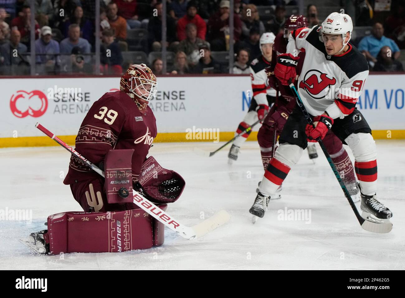 Arizona Coyotes goaltender Connor Ingram makes the save in front of New ...