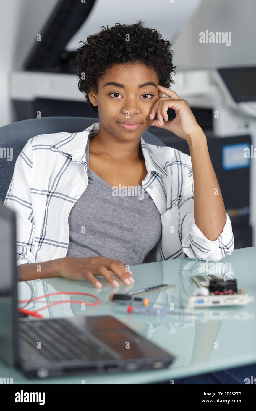 young female electronic engineer testing computer pc motherboard in ...