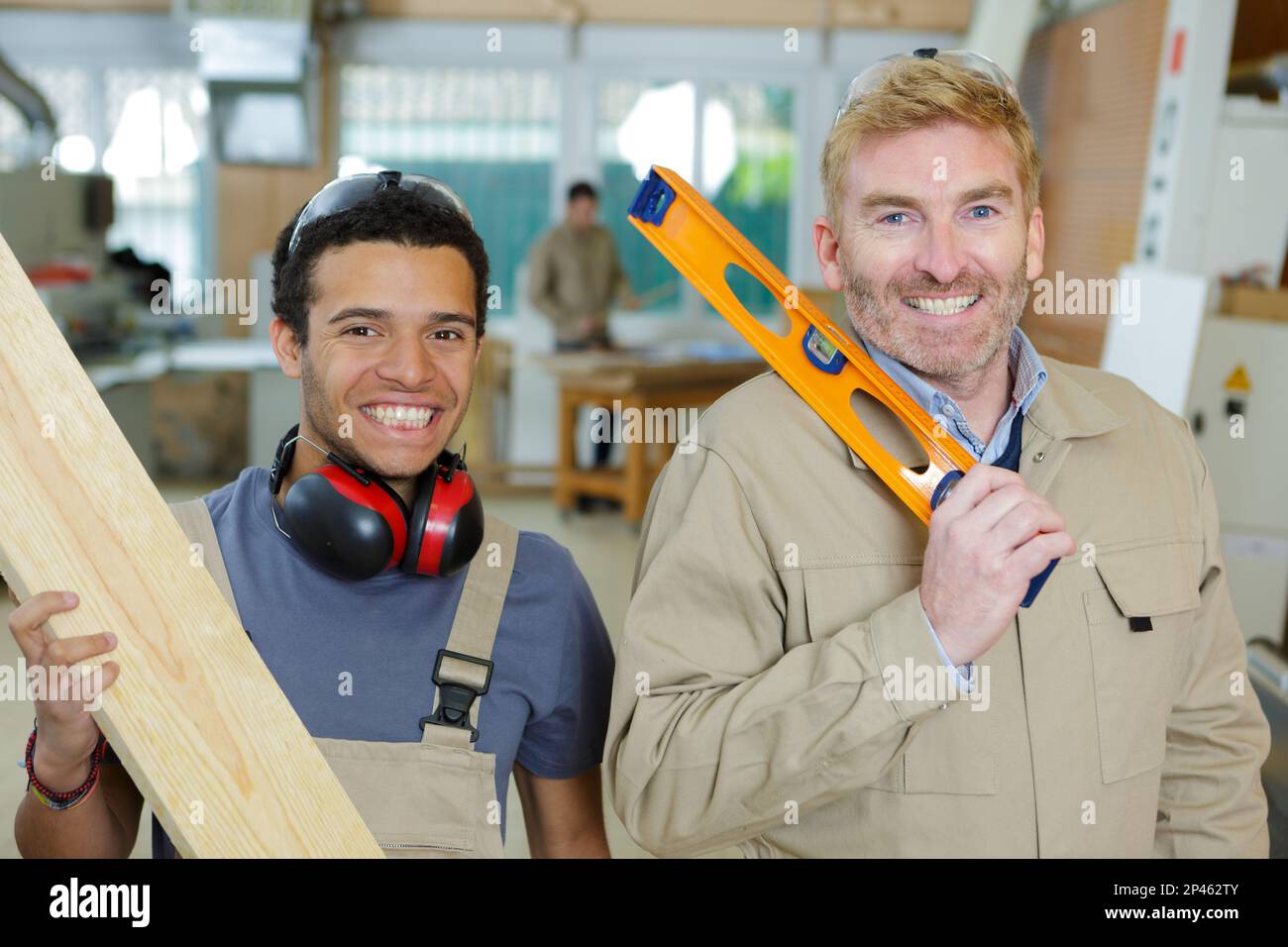 Two construction workers measuring hi-res stock photography and images ...