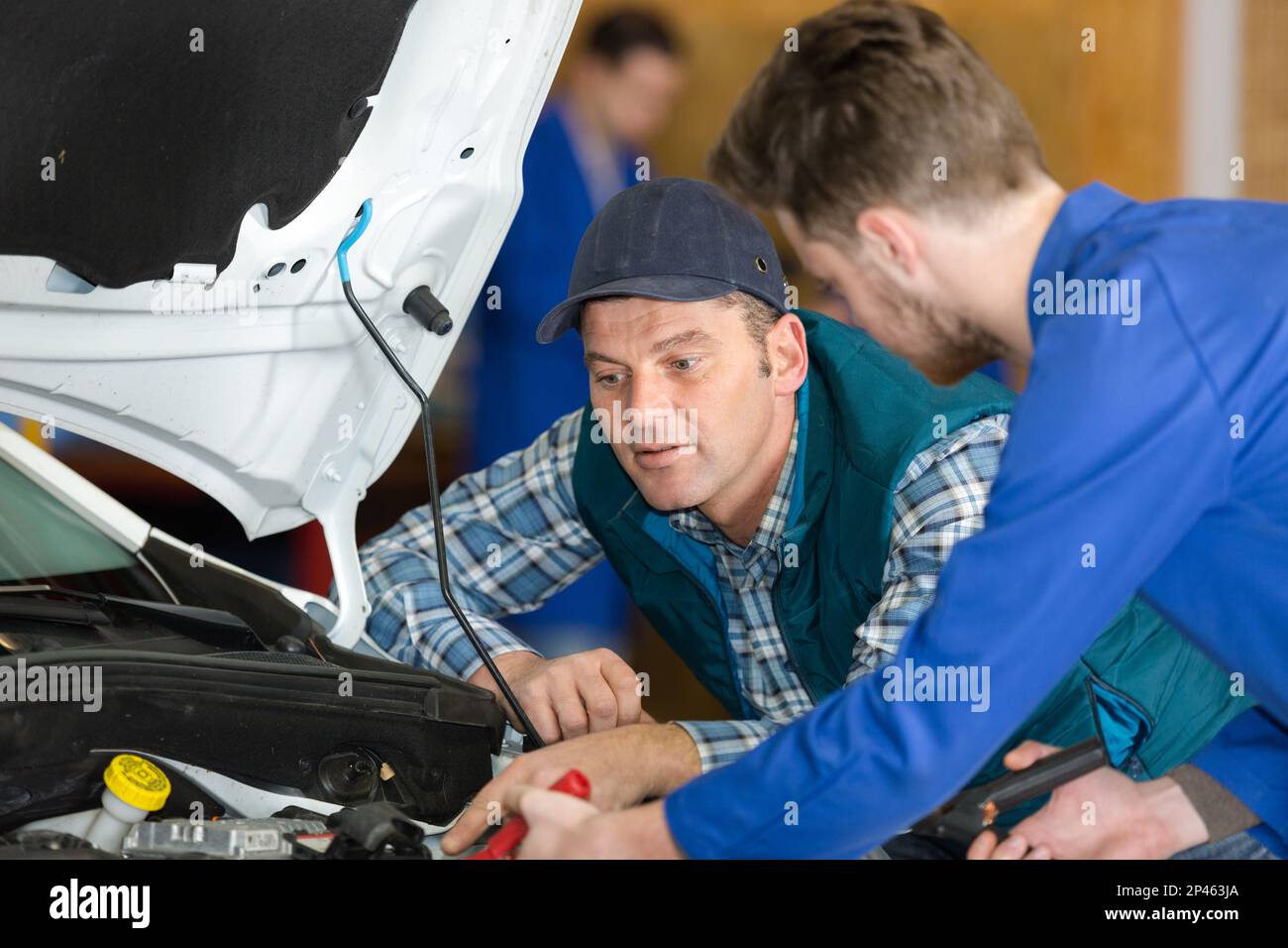 experienced auto mechanic checking the parts of a car Stock Photo - Alamy