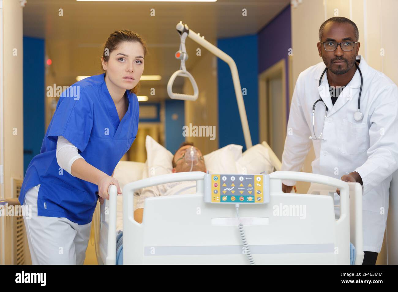 doctor and nurse taking patient on stretcher in hospital Stock Photo ...