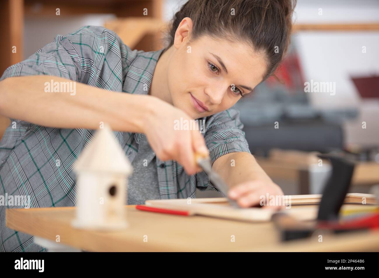female carpenter working with a chisel in workshop Stock Photo - Alamy
